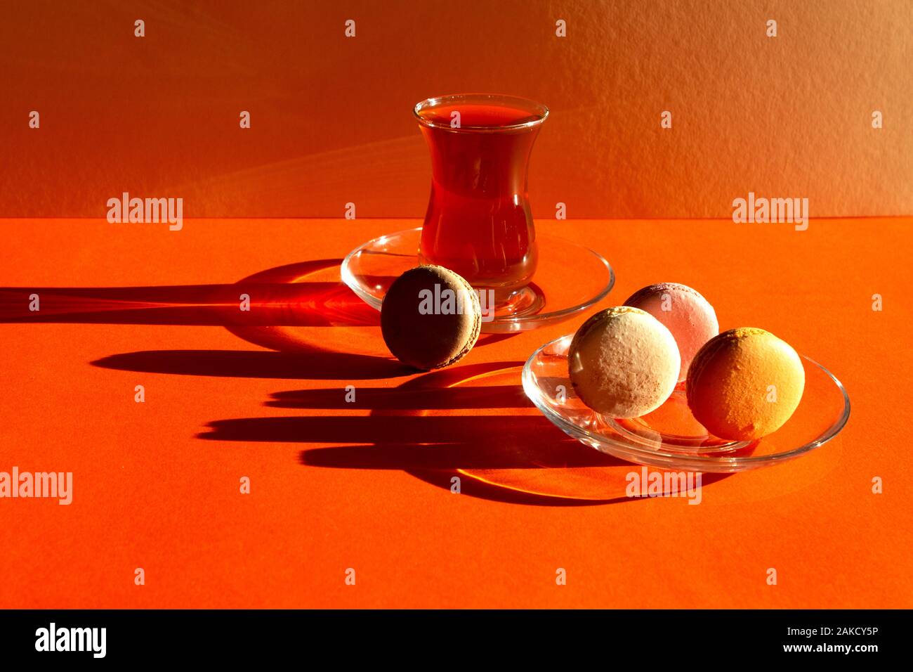 Traditional Turkish glass tea with sweets casts a dark shadow. French ...