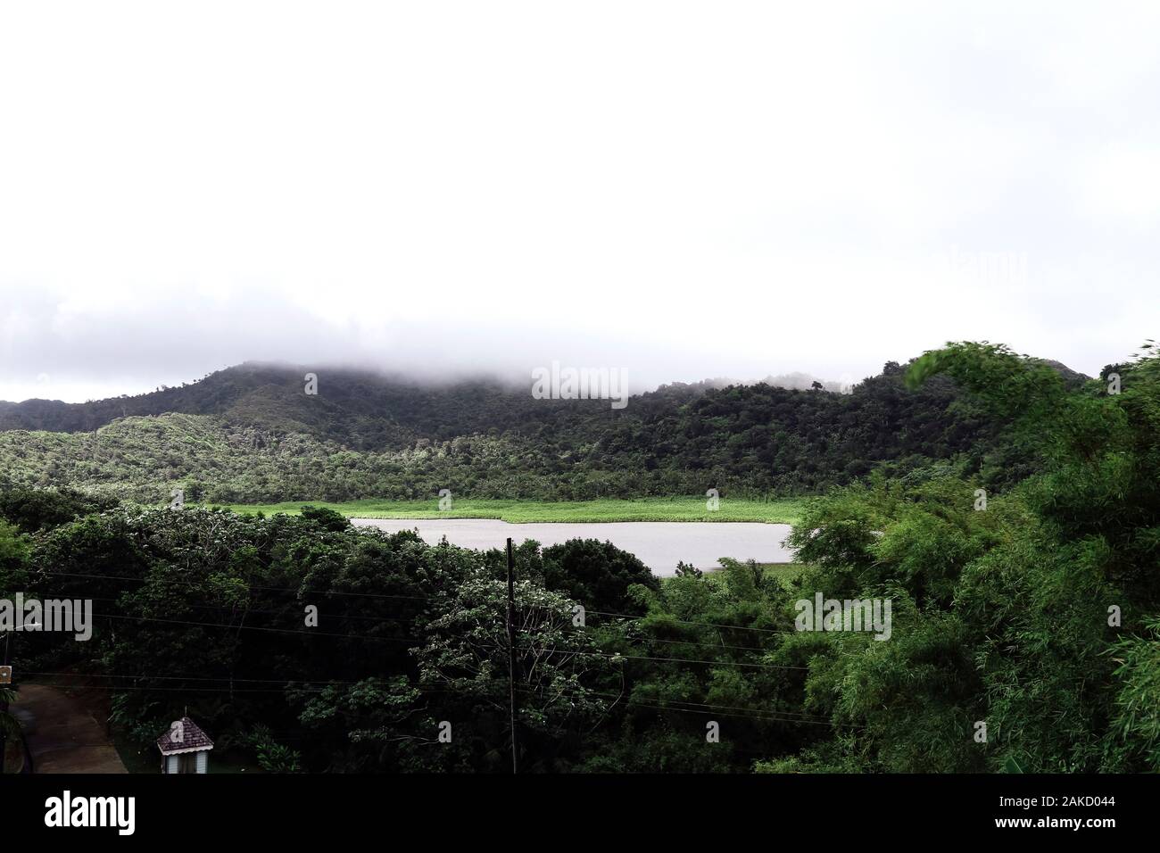 Beautiful lake in rainforest and mountains. Grand Etang National Forest ...