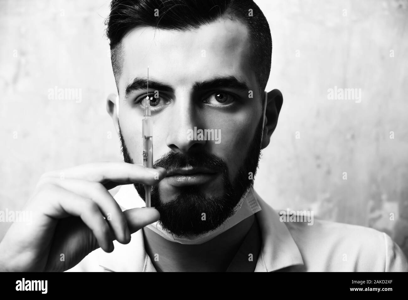 Concept of first aid and healthcare: unshaved doctor with assured face ...