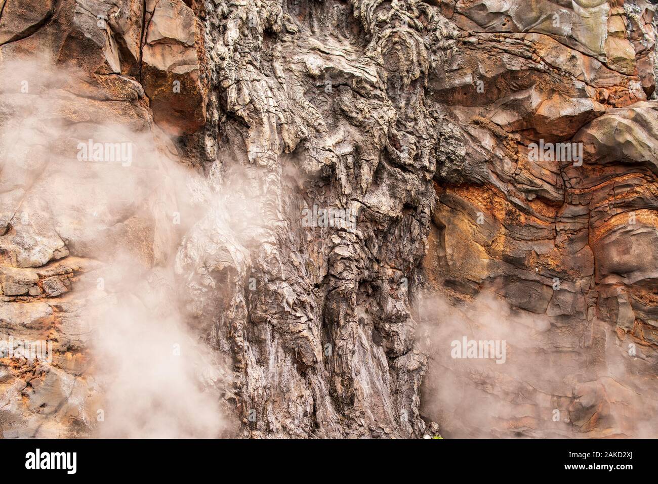 Stone gray-brown. A rocky wall with smoke around. Structural stone ...