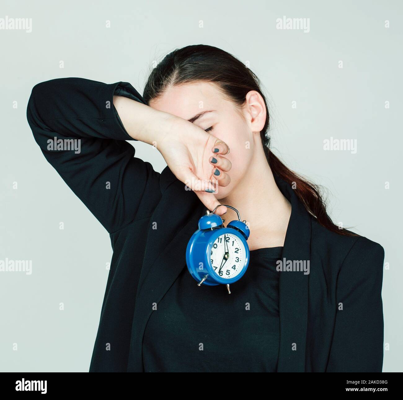 young beauty woman in business style costume waking up for work early ...