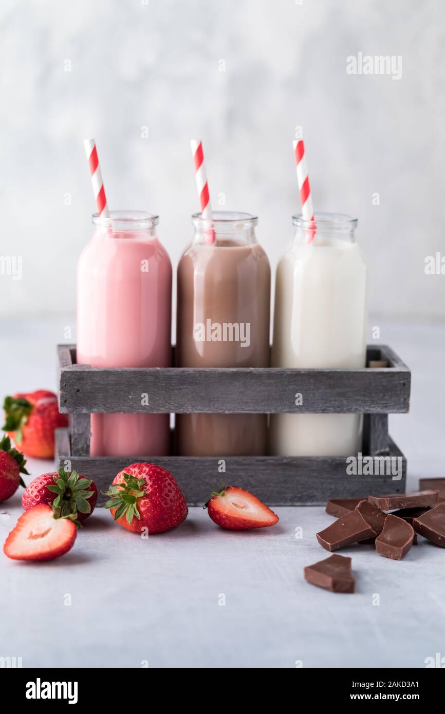 Three bottles of flavoured milk Stock Photo - Alamy