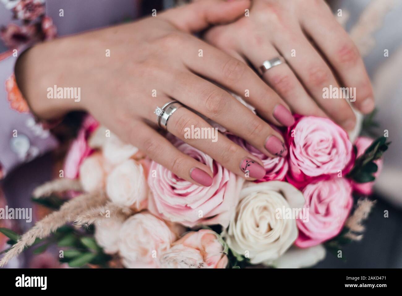 Engaged couple holding hands hi-res stock photography and images - Alamy