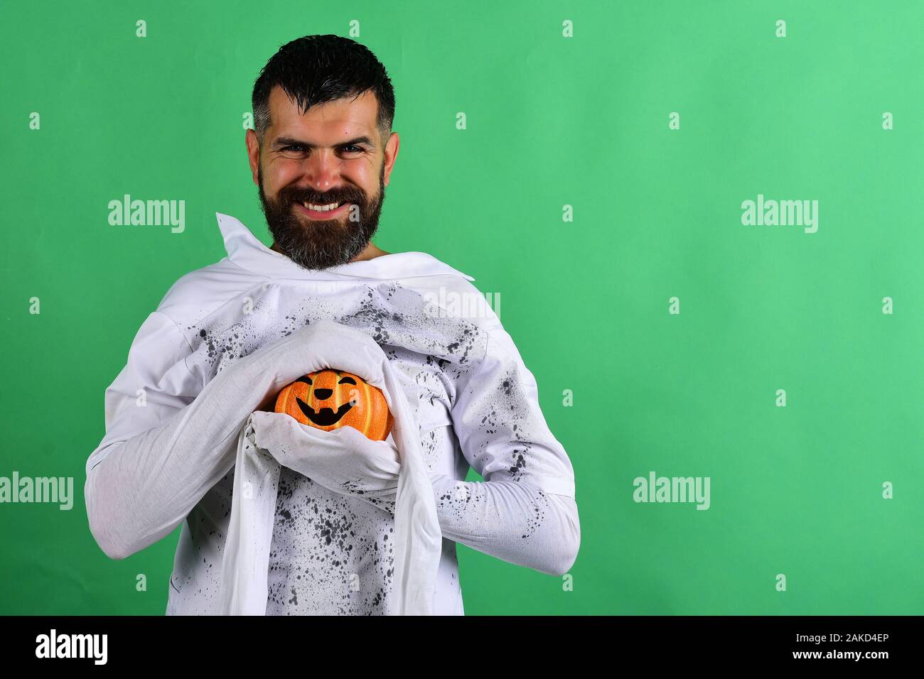 Man with smiling face expression on green background, copy space. Guy ...