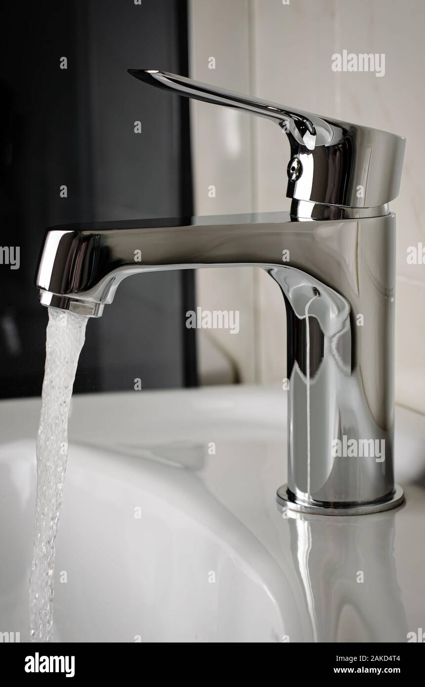 Close up of water dripping from faucet hi-res stock photography and ...