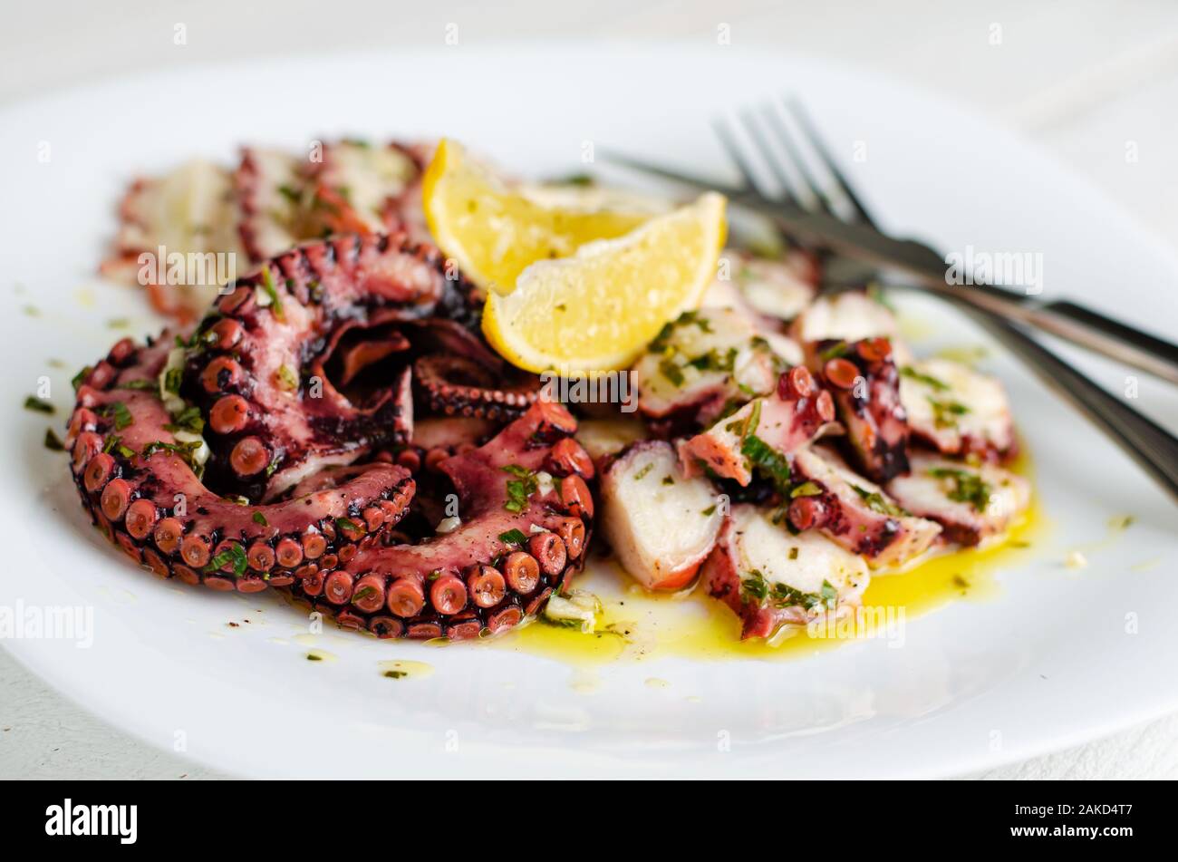 Octopus carpaccio on white background. Mediterranean food, Organic ...