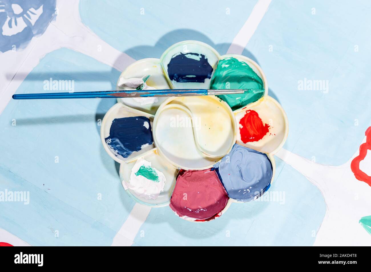 Children's palette and brush. Palette with paints Stock Photo - Alamy
