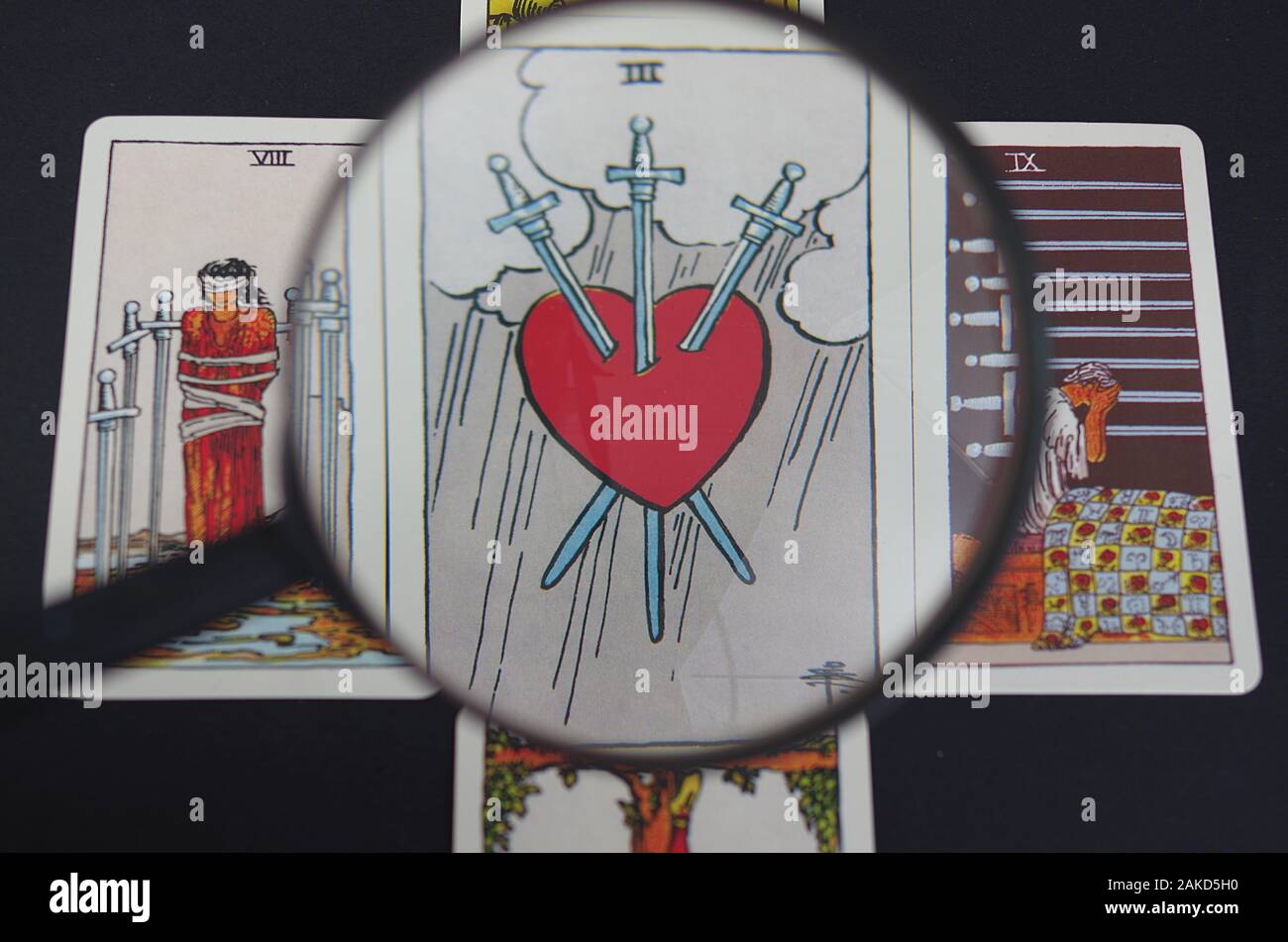 Three of swords tarot card Stock Photo - Alamy