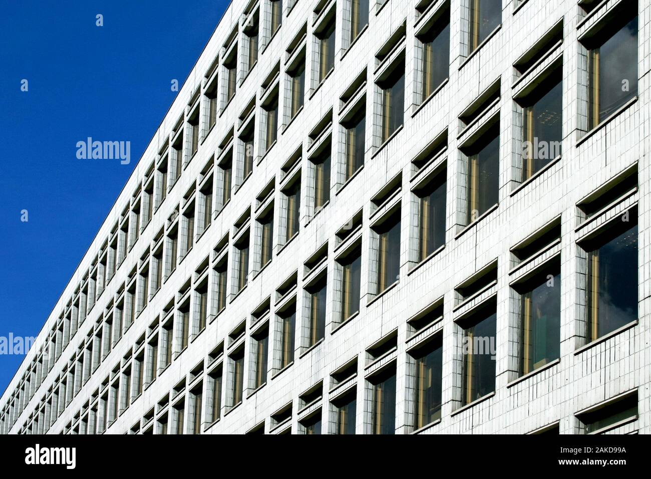 Long white business building with vanishing perspective Stock Photo - Alamy