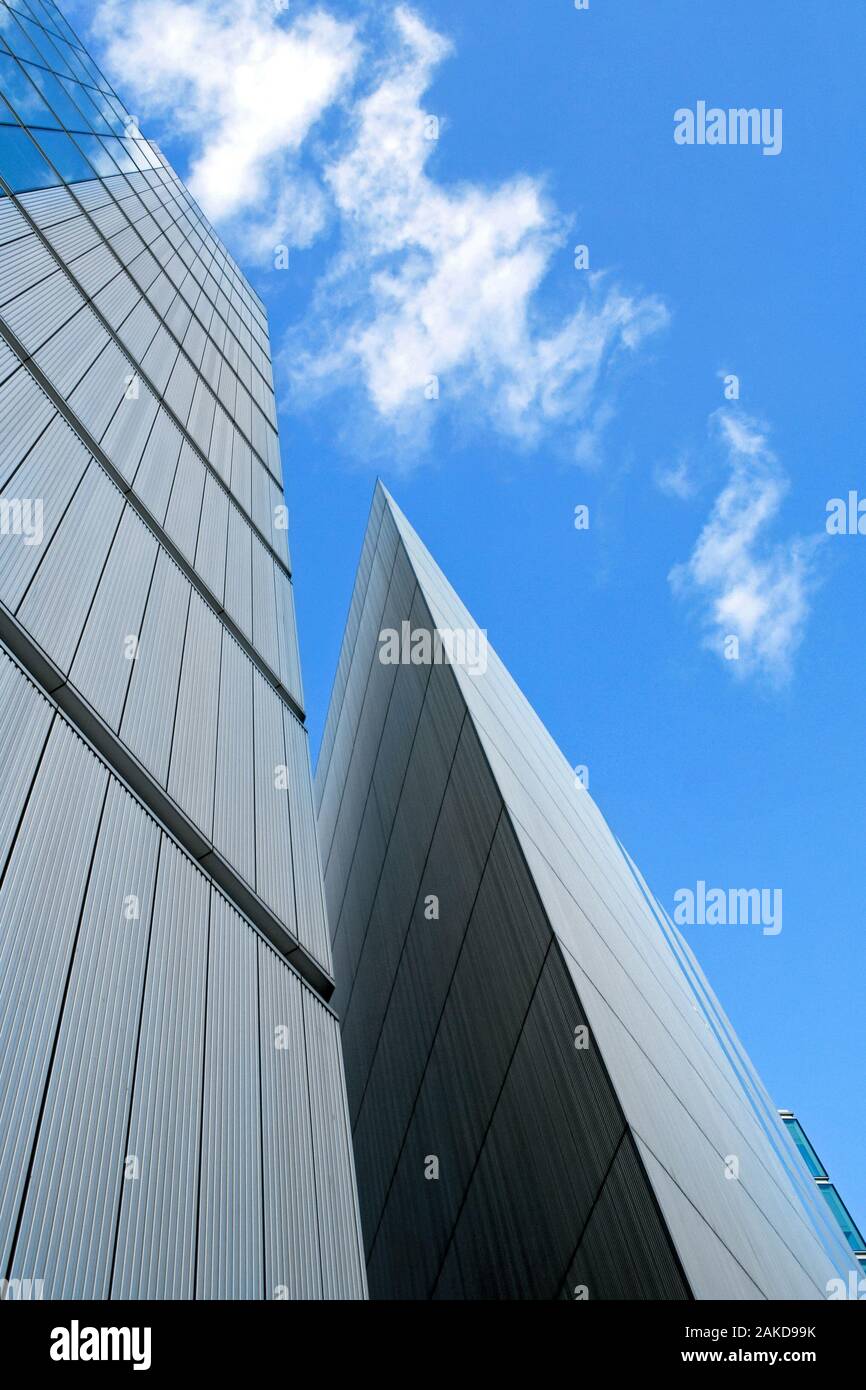 Very sharp skyscraper building over blue sky Stock Photo - Alamy