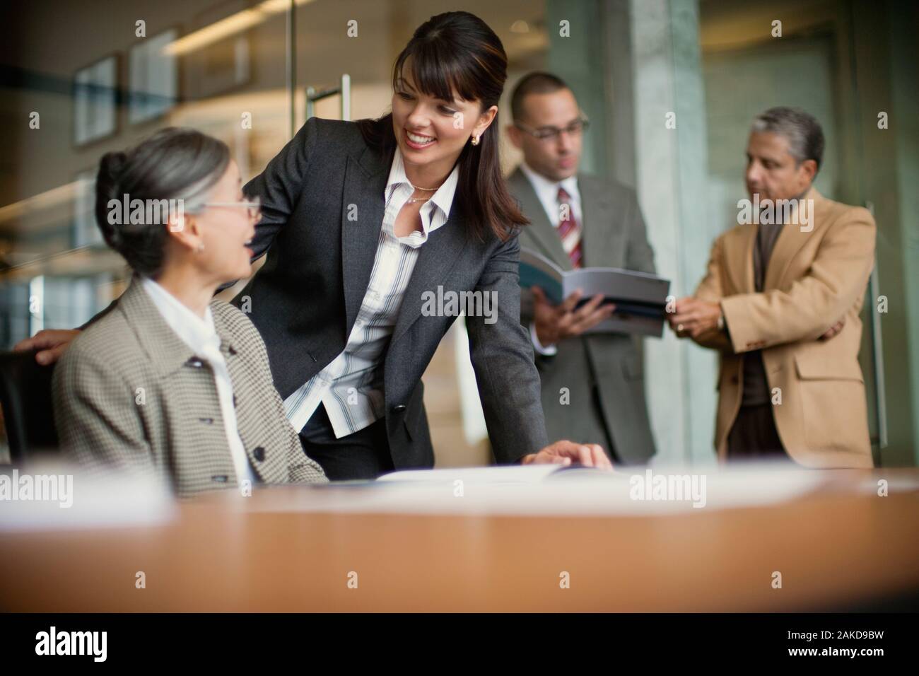 Businesswoman assisting her client during a business meeting Stock ...
