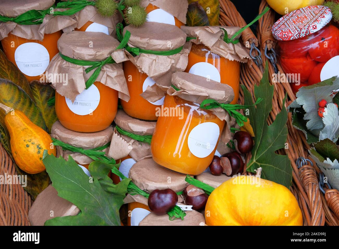 Jars with homemade pickled or fermented colorful vegetables in farmer ...