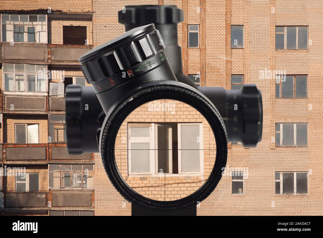 view through an optical sight at the abandoned apartment building Stock ...