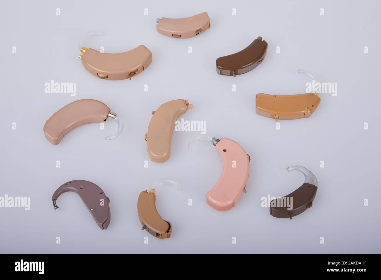 Various old-fashion hearing aids on white background, alternative to ...