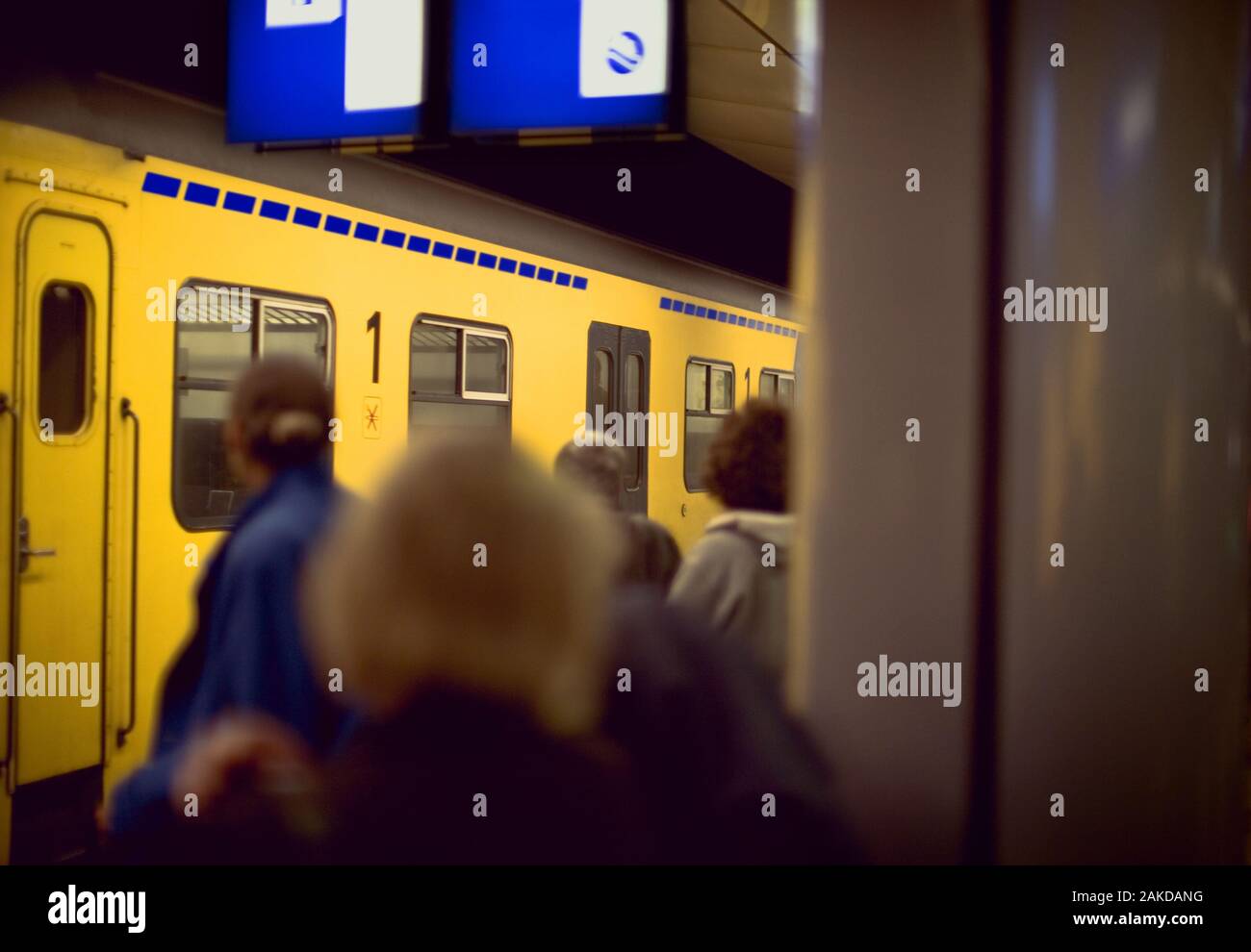 Commuters waiting for their train in a subway Stock Photo - Alamy