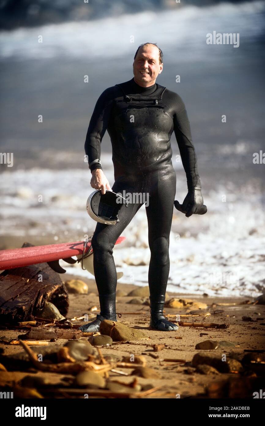 Front view of a surfboarder Stock Photo - Alamy