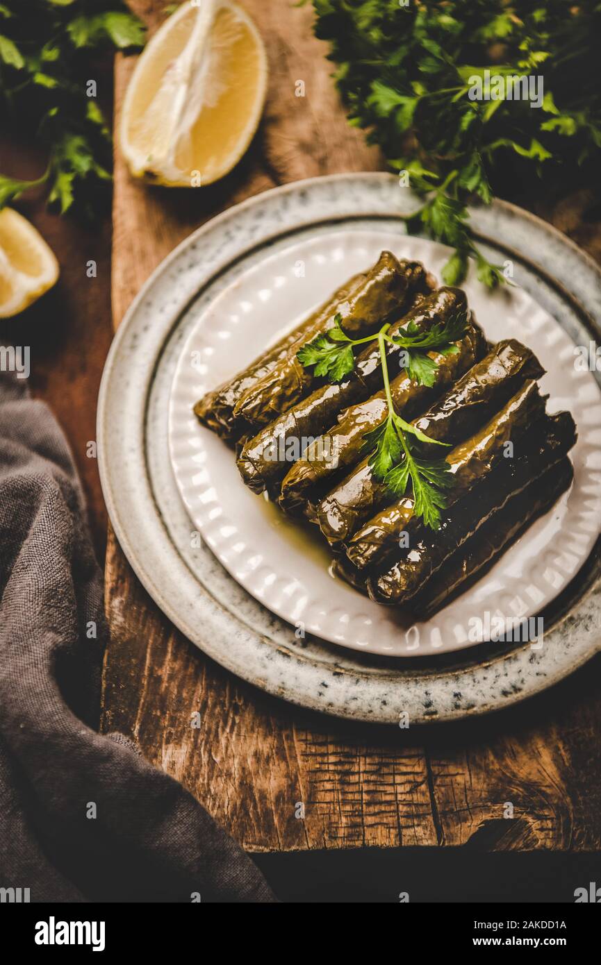 Turkish traditional Dolma with rice and spices over wooden background ...