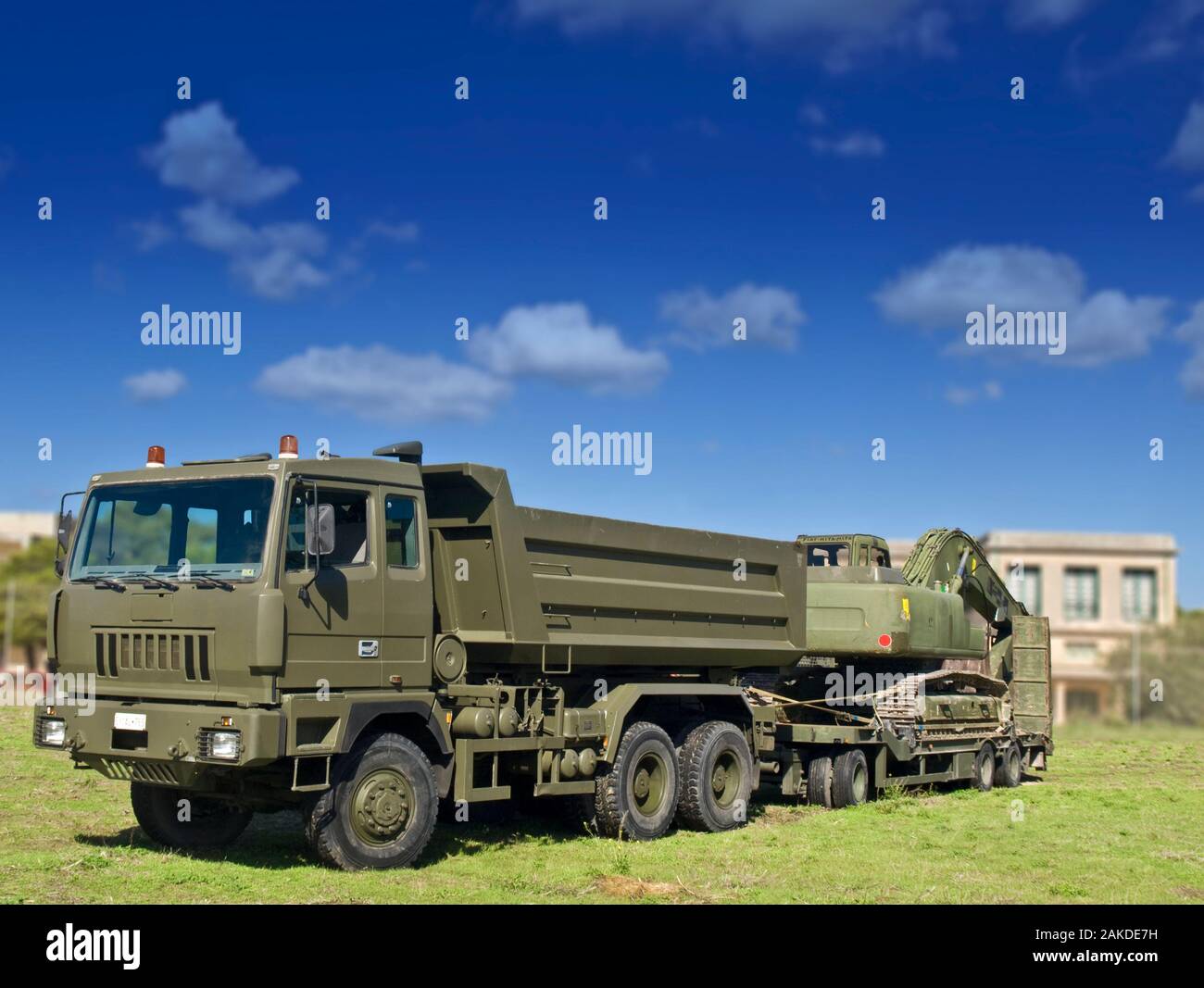 Military heavy truck and mechanical shovel in tow Stock Photo - Alamy