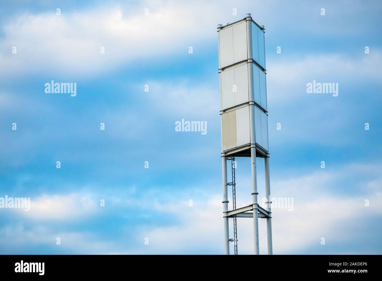 A low angle view of a radio signal tower, tall steel frame with access ...