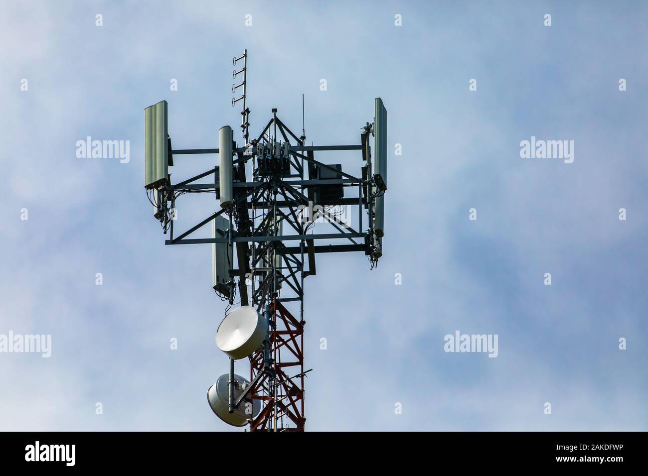 A close up shot on the top of a cellular base station tower. Details of ...