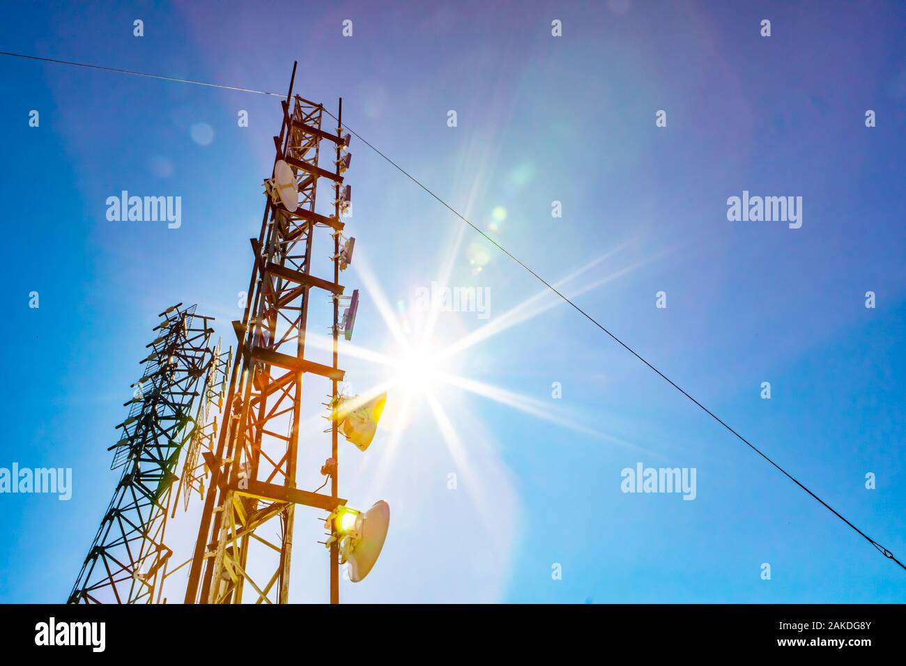 A low angle view of two mobile communication data transmitter and GPS ...