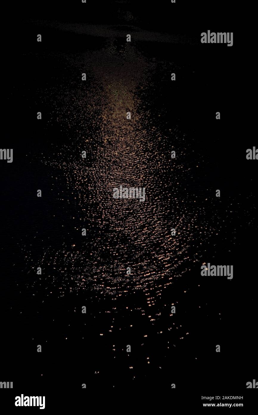 Golden light glow texture as an abstract black background Stock Photo ...