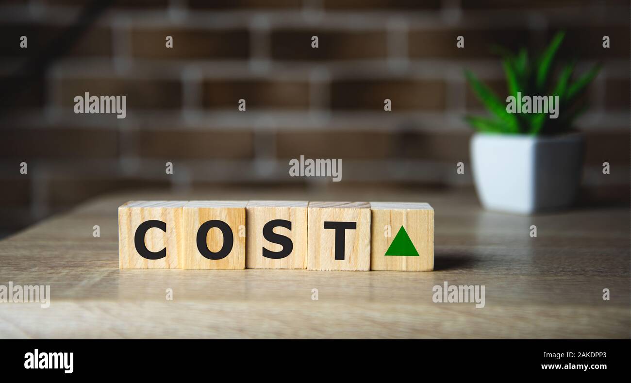 COST word made with building blocks on brick background Stock Photo - Alamy