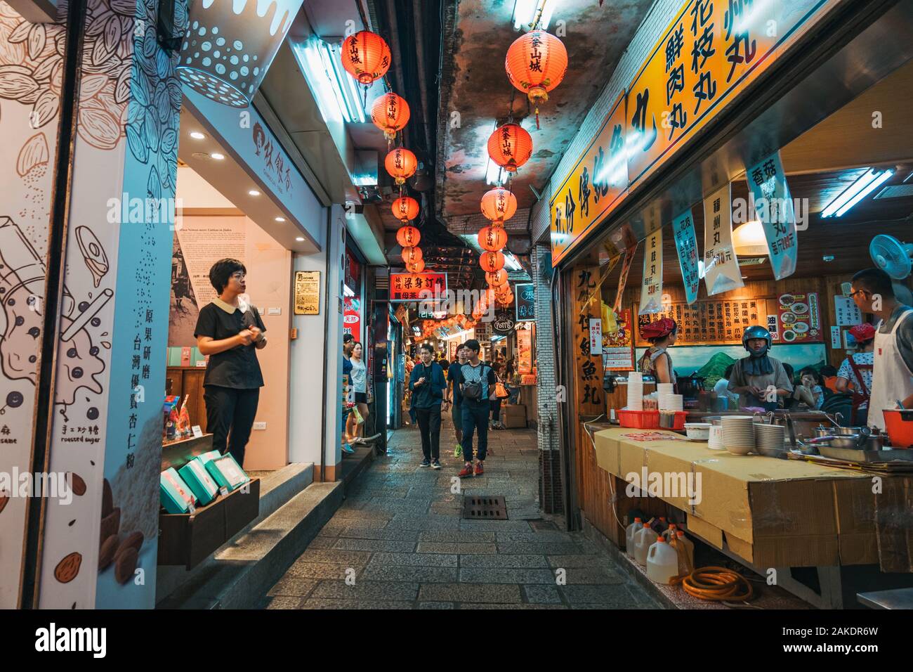 Lanterns hang along the narrow market streets of Jiufen Old Street, a ...