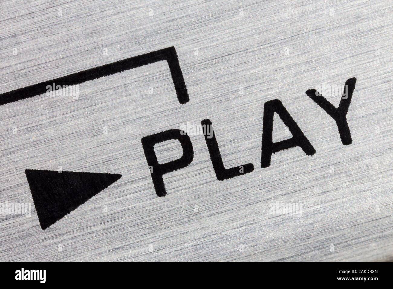 Macro close up photograph of vintage tape machine play button function ...