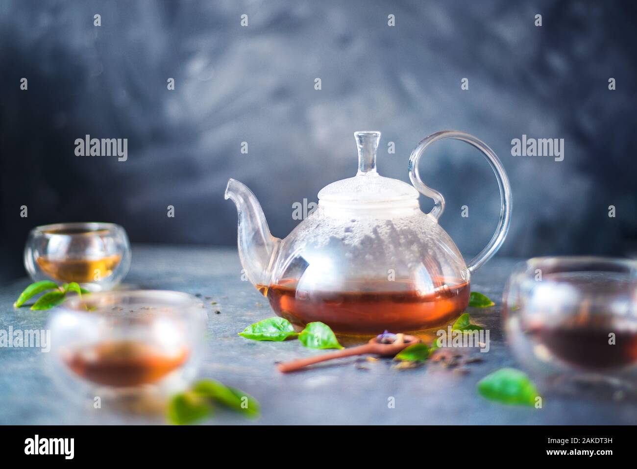 Morning teatime header, cozy glass tea set with leaves and steam Stock ...