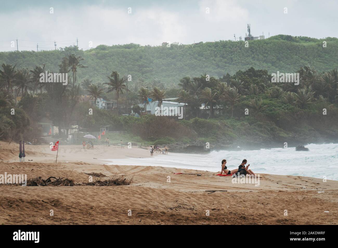 Tourists on Baisha Beach (Bai Sha Wa), in southern Taiwan used as a ...