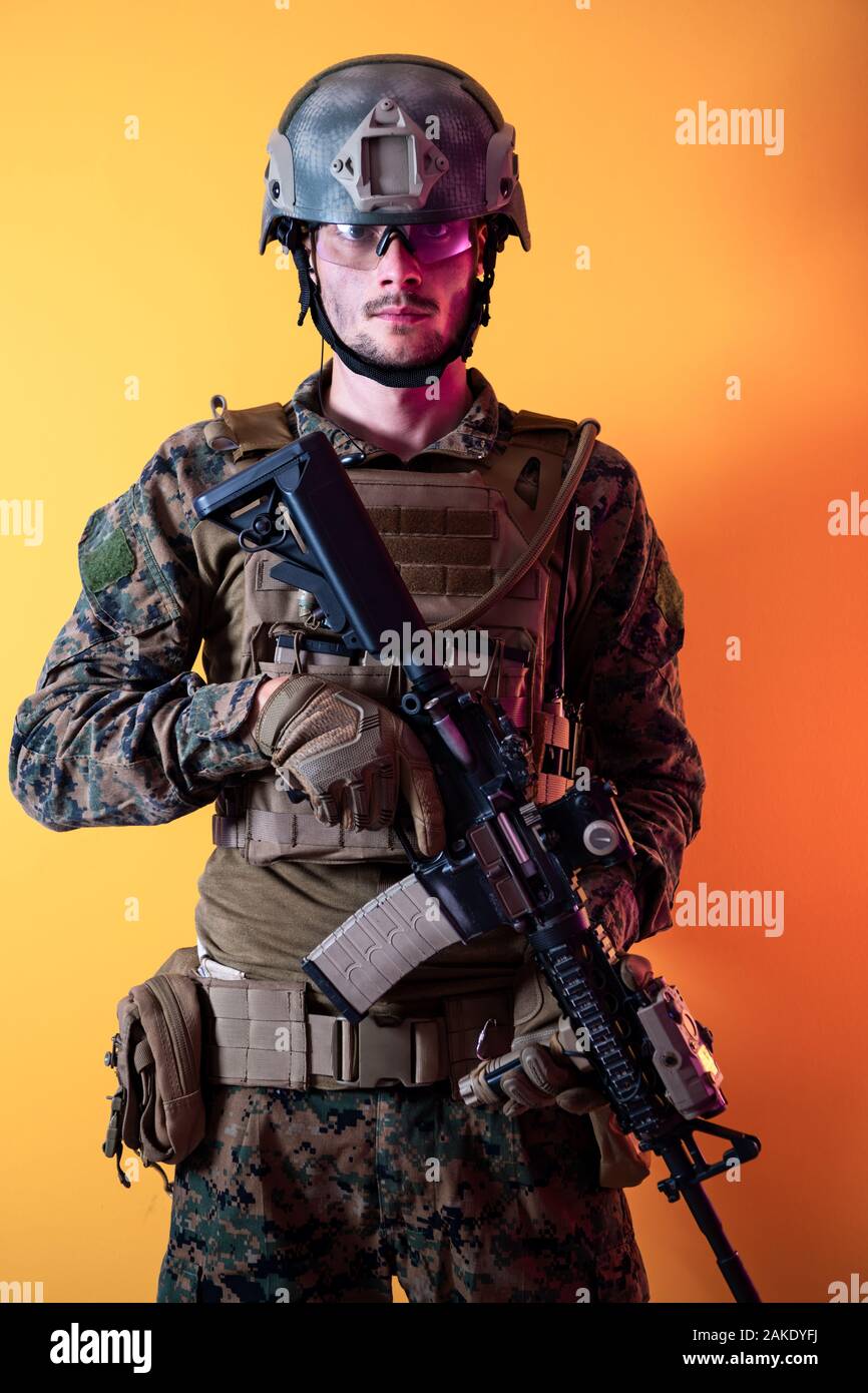 modern warfare marine soldier with fire arm weapon and protective army ...