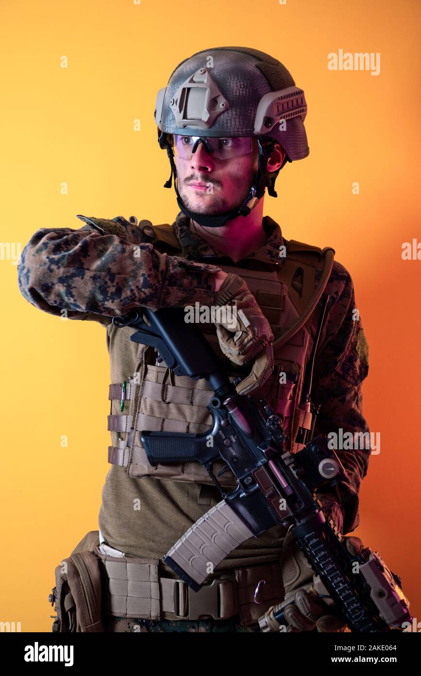 modern warfare marine soldier with fire arm weapon and protective army ...