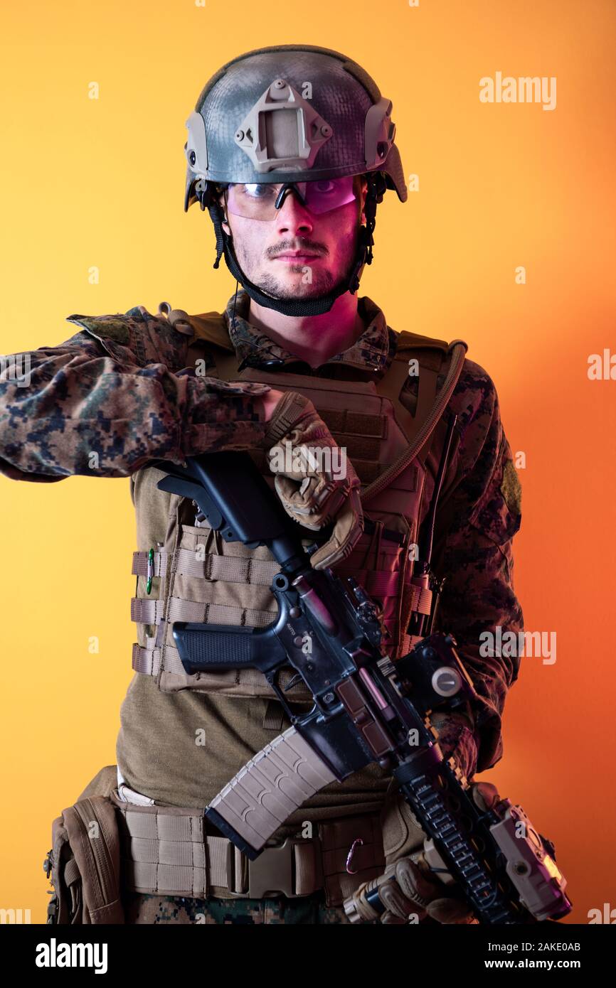 modern warfare marine soldier with fire arm weapon and protective army ...