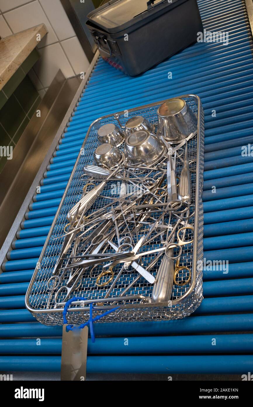 in the sterilization department clean instruments are pushed into the ...