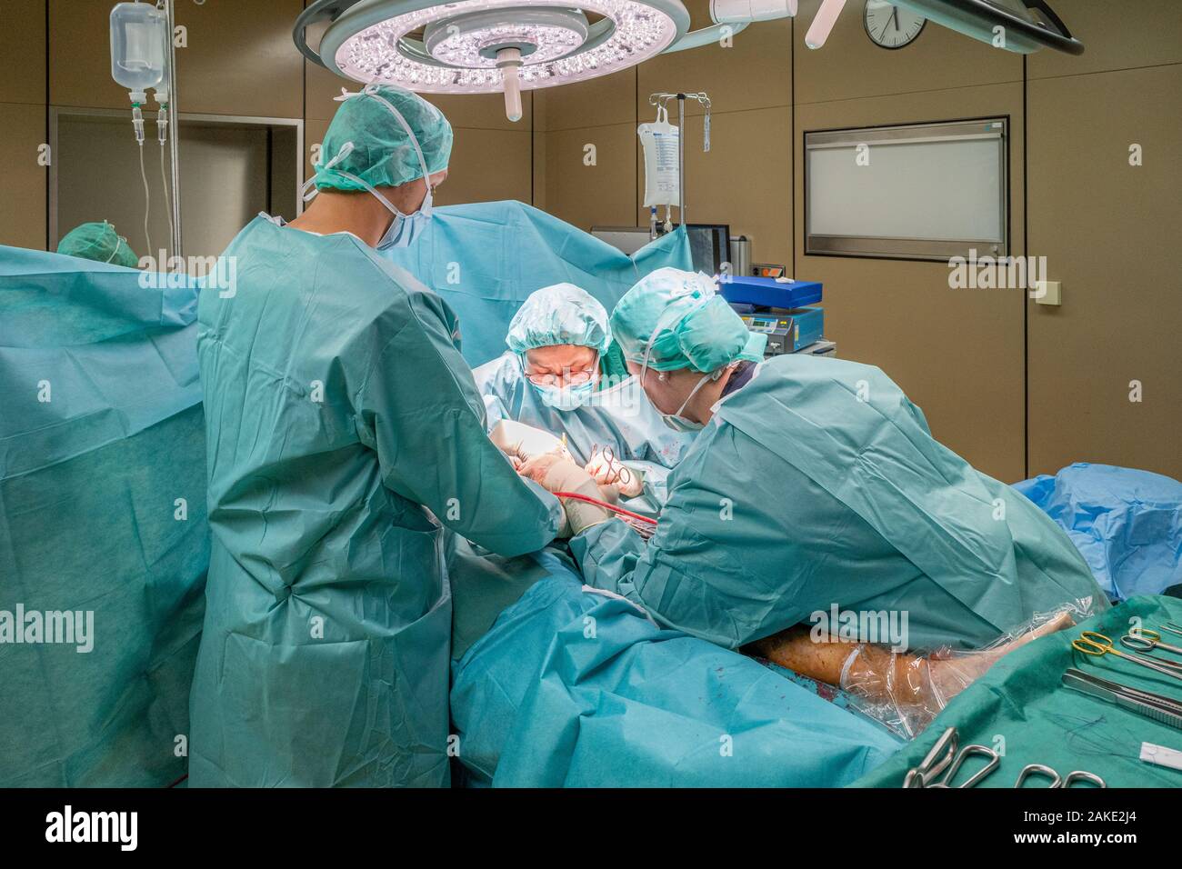 in an operating room a vascular operation is performed by 2 doctors ...