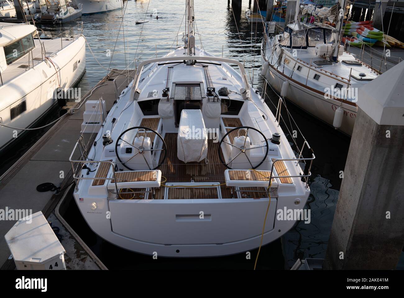 Deck of parked yacht boat and dual steering wheels Stock Photo - Alamy
