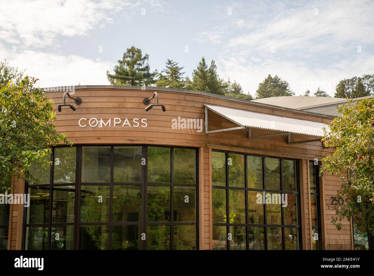 Compass real estate agency location building Stock Photo - Alamy