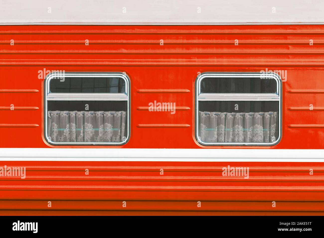 Symmetrical windows of the red locomotive wagon Stock Photo - Alamy