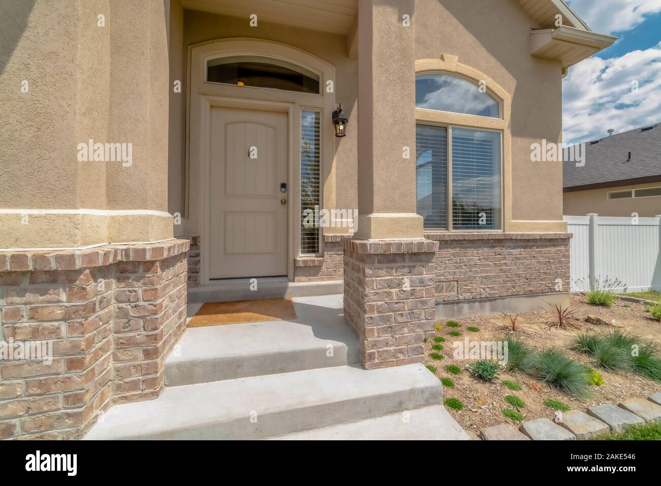 Home entrance with steps white front door sidelight arched windows and ...