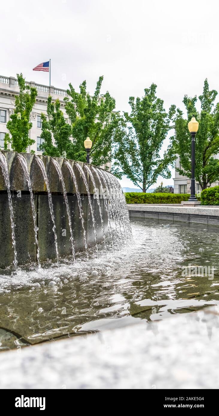 Vertical Circular water fountain with Utah State Capital Building in ...