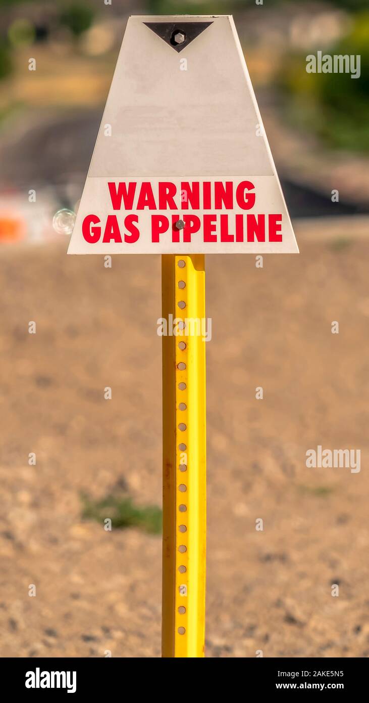 Vertical Selective focus of a Warning Gas Pipeline sign for security ...