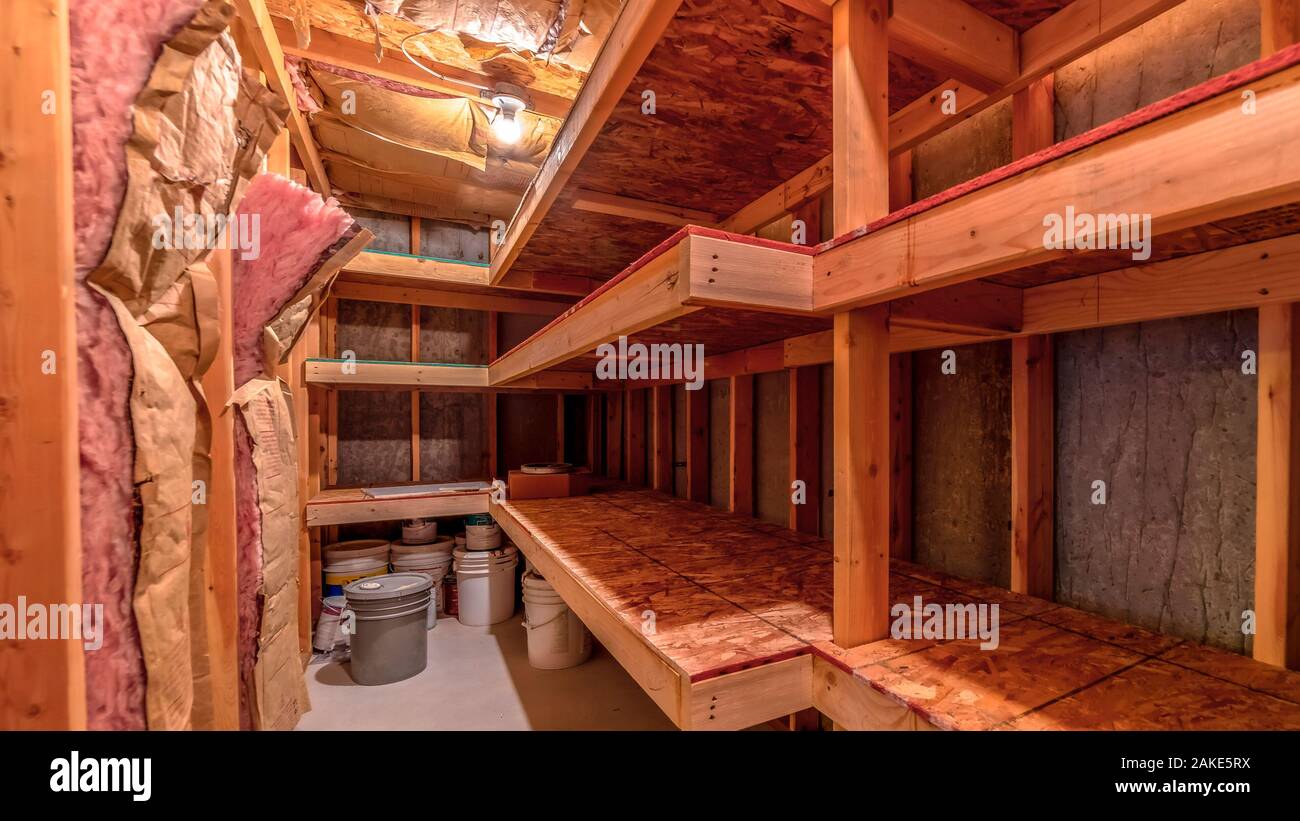 Panorama Interior of food cold storage with wooden racks and insulated ...