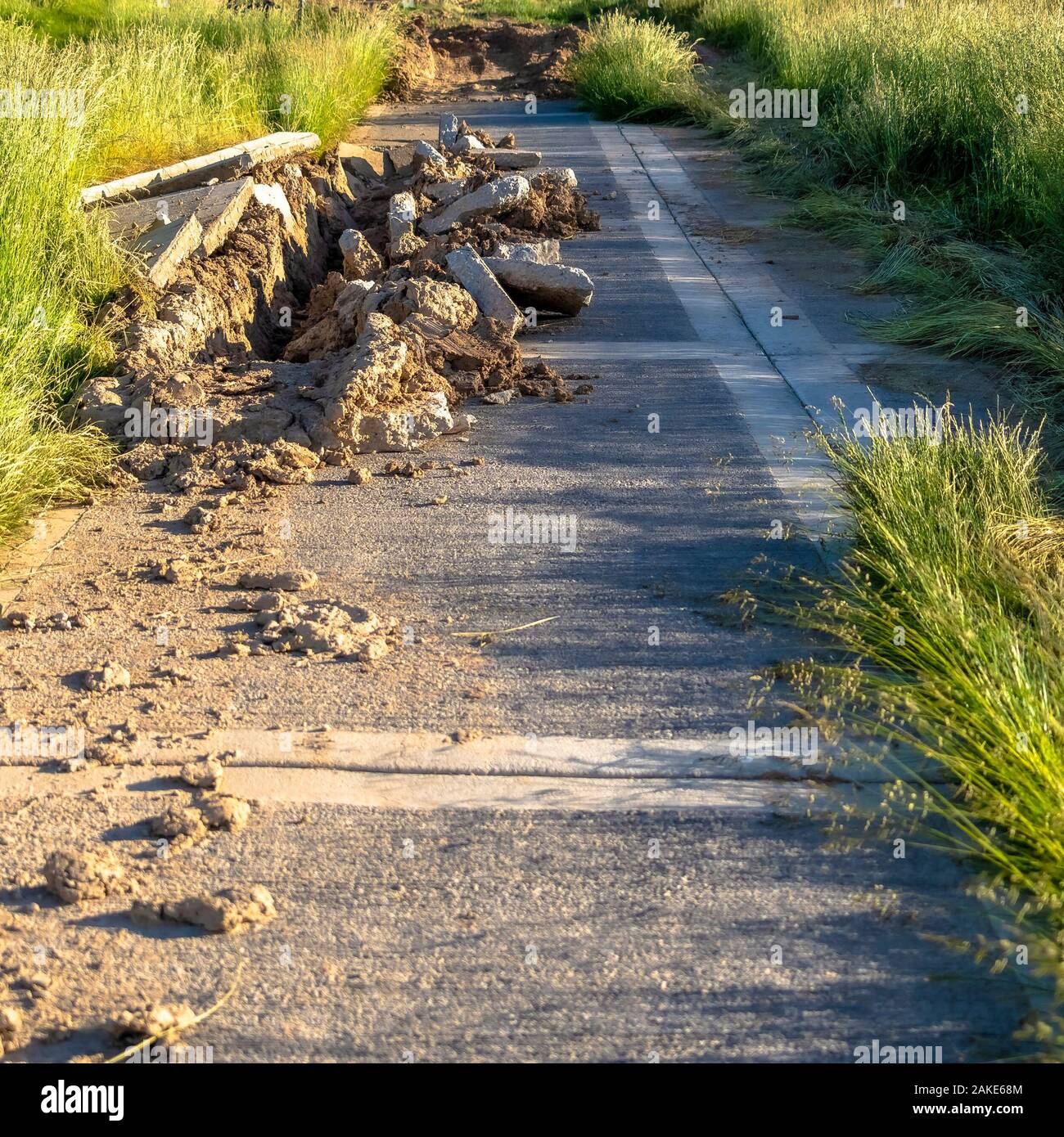 Square frame Road construction with damaged concrete paved road viewed ...