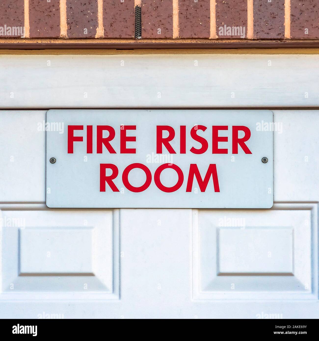 Square frame Close up of the Fire Riser Room with white wooden door of ...