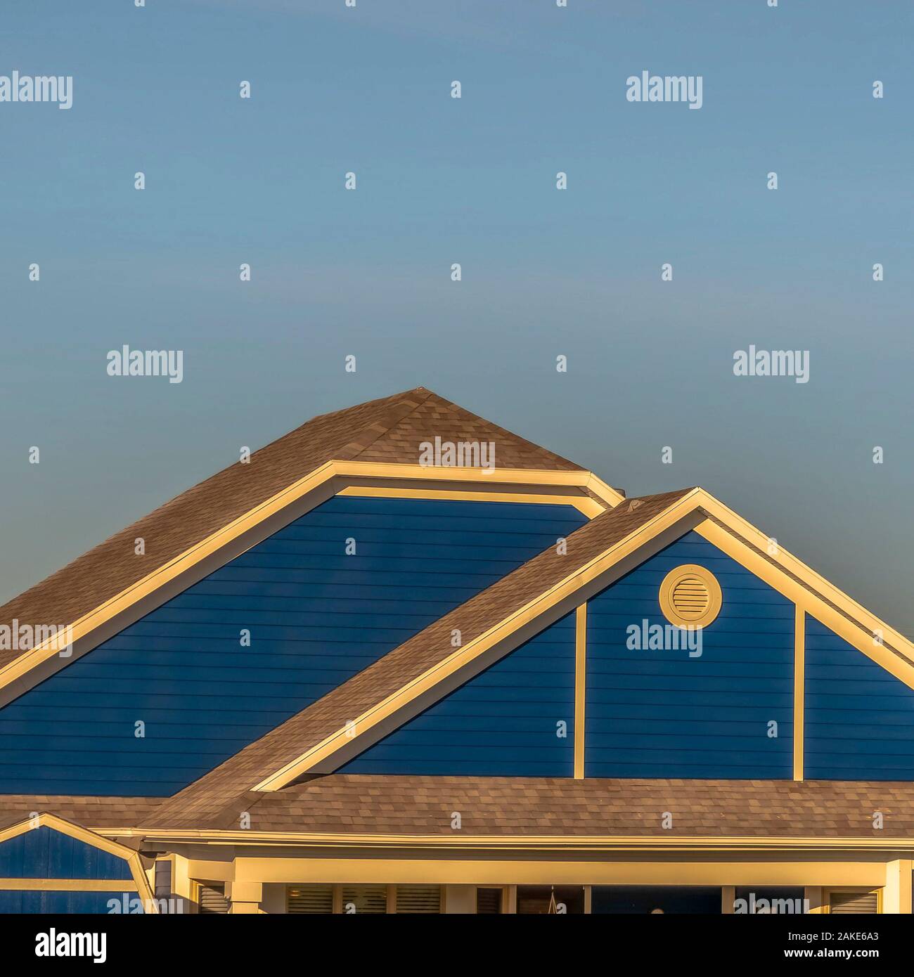 Square Close up of roof structure of home with blue gable wall and ...