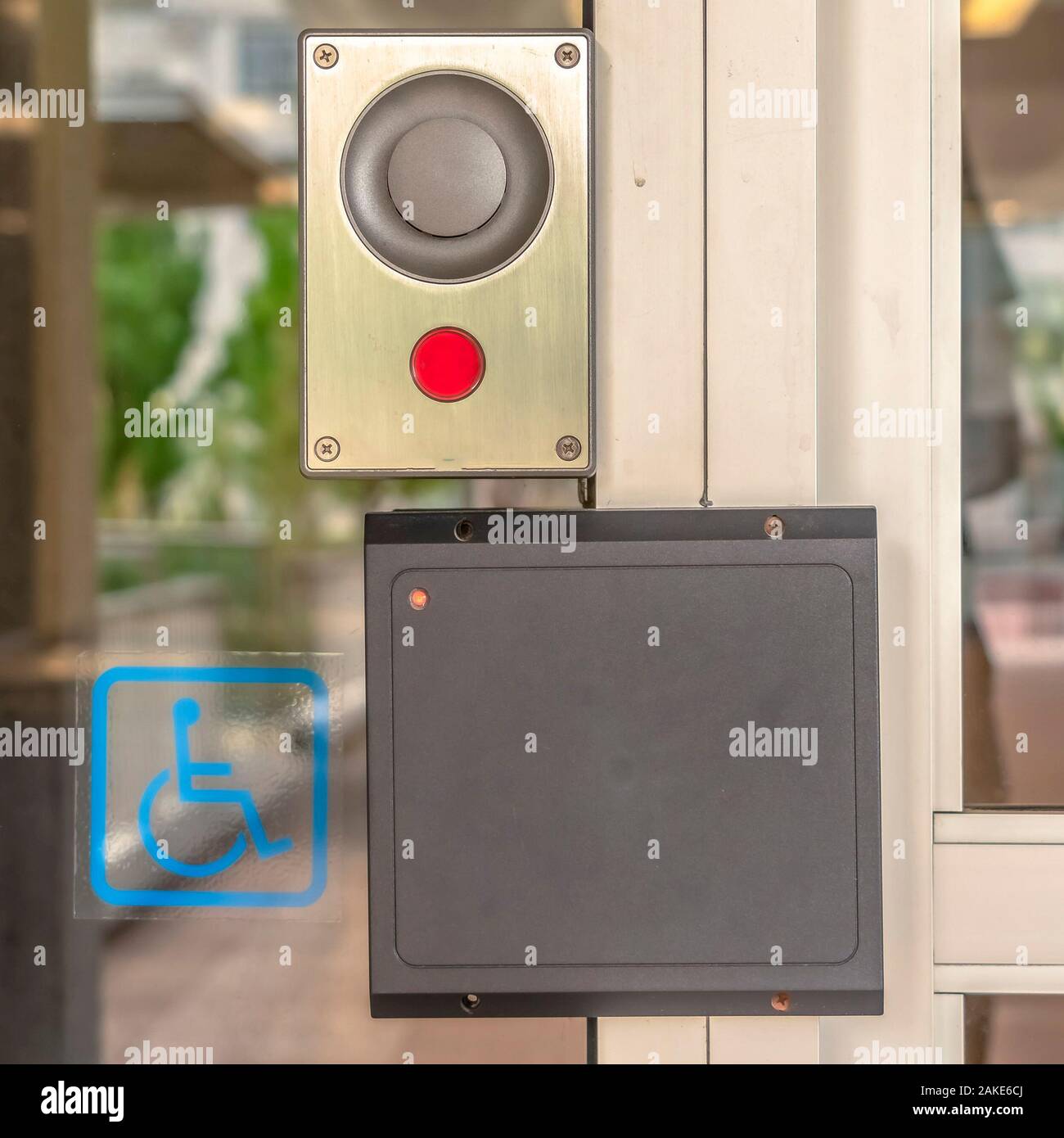 Square Glass door of a modern building with security key card reader ...