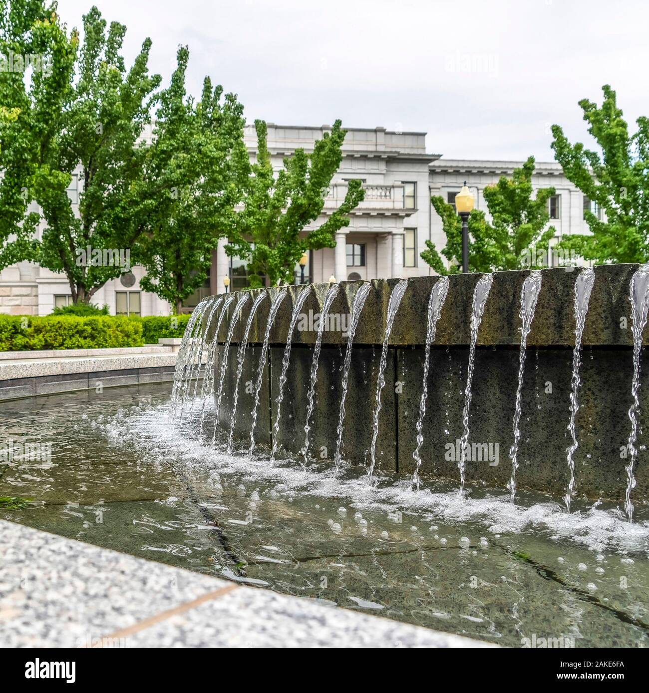 Square Water fountain with clear trickling water at Utah State Capitol ...