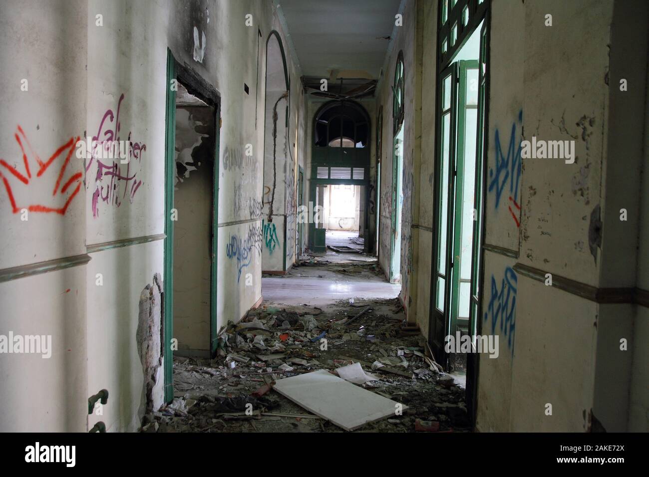 Interior hall and corridor of an old abandoned and ruined hotel near ...