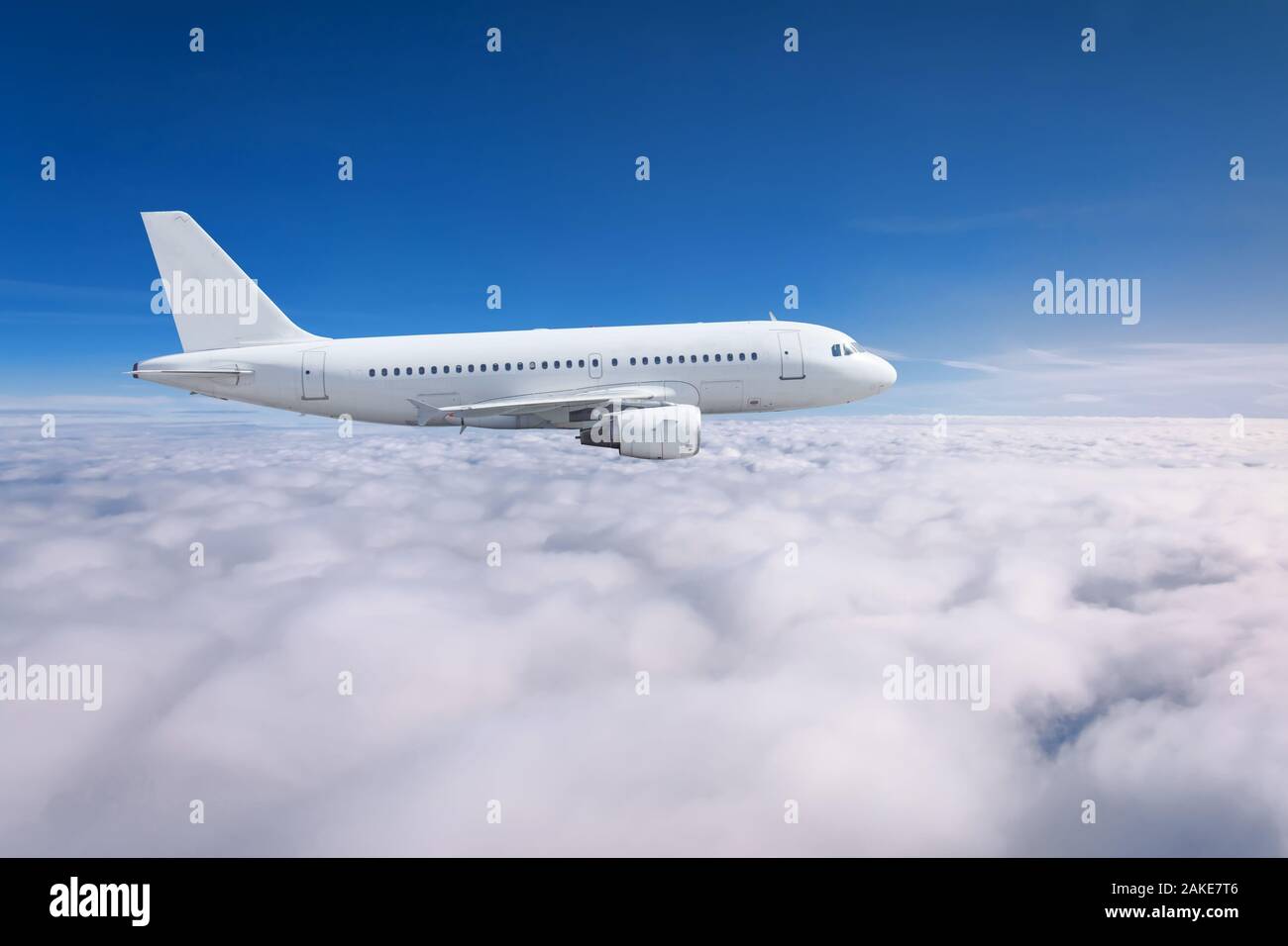 Passenger airplane descend and low flying overcast Stock Photo - Alamy
